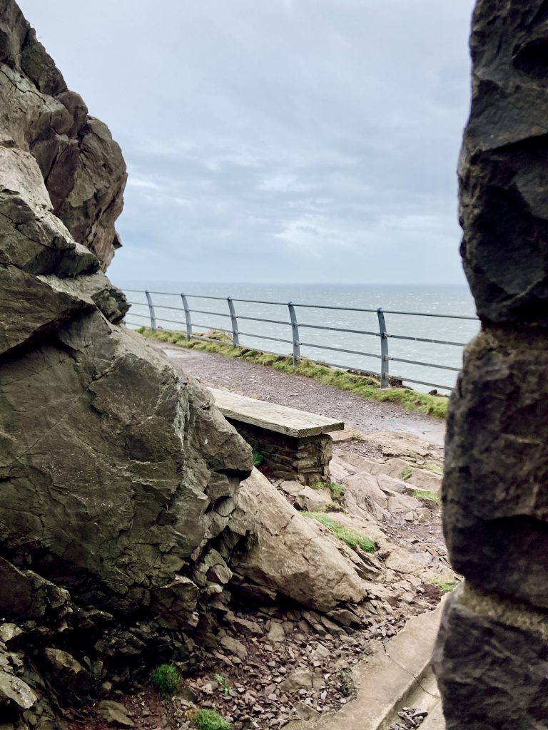 Bench and rocks and railing at Hurlstone Point | The Best of Exmoor Blog
